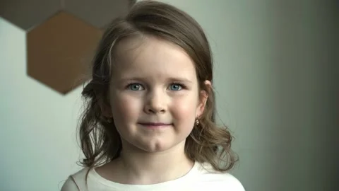 Portrait of pretty 5 year old girl with ... | Stock Video | Pond5