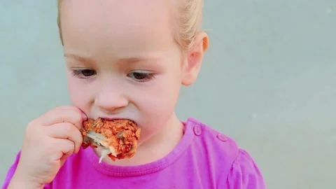 portrait of a pretty little kid girl eat... | Stock Video | Pond5