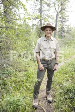 Portrait of ranger standing in forest Stock Photo #201997970