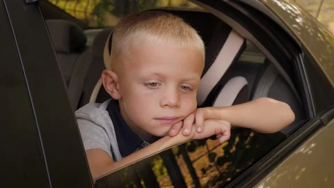 Portrait of a sad boy in the car in the ... | Stock Video | Pond5