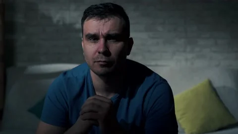 Portrait of a sad man crying in dark roo... | Stock Video | Pond5