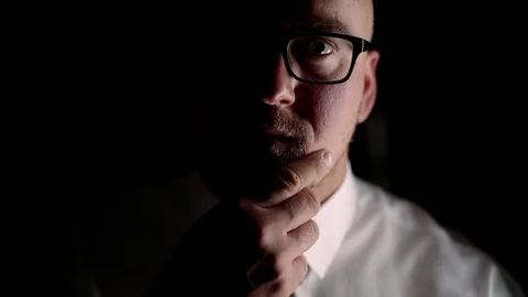 Portrait of sad man in dark room with ha... | Stock Video | Pond5