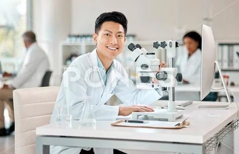 Portrait, science and microscope with an asian man doctor working in a ...