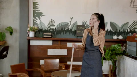 Portrait, shopkeeper is young Asian lady... | Stock Video | Pond5