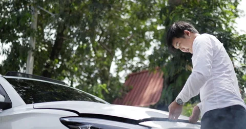 Portrait side view of Man open the hood ... | Stock Video | Pond5