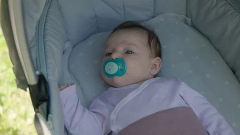 Portrait - A small newborn baby girl suc... | Stock Video | Pond5