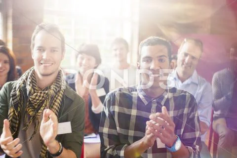 Portrait of smiling audience clapping Stock Photo #50954570
