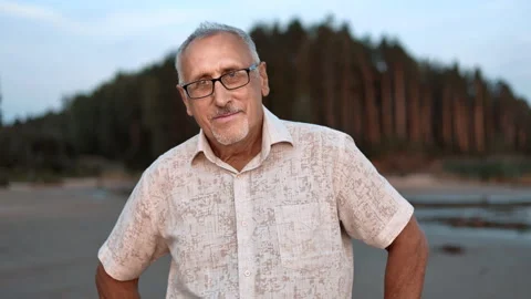 Portrait smiling old 70s grandfather pos... | Stock Video | Pond5