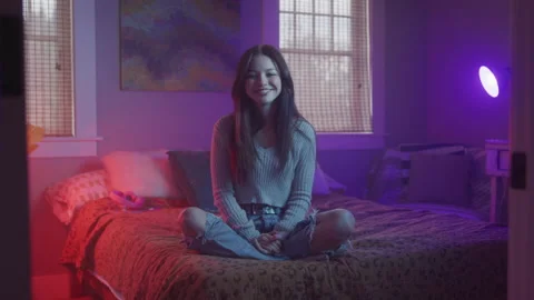 Portrait of a Smiling Teenage Girl Sitti... | Stock Video | Pond5