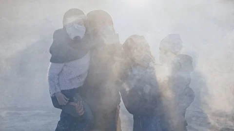 Portrait of survivor family in gas mask ... | Stock Video | Pond5