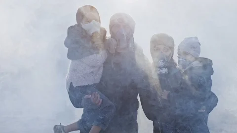 Portrait of survivor family in gas mask ... | Stock Video | Pond5