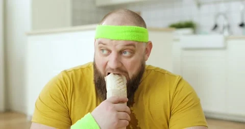 Portrait of sweaty fat man in yellow wet... | Stock Video | Pond5