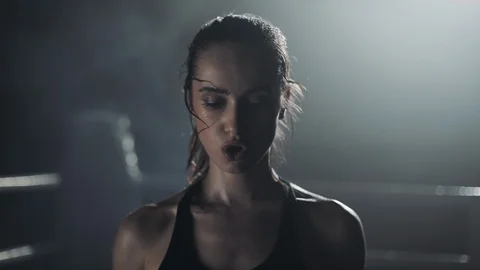 Portrait of tired female boxer standing ... | Stock Video | Pond5