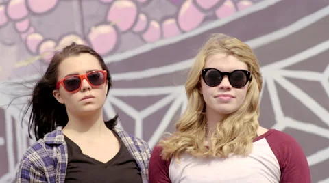 Portrait Of Two Cool Girls Standing In F... | Stock Video | Pond5