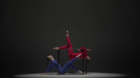 Portrait of two female acrobats isolated... | Stock Video | Pond5