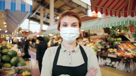 Portrait of vendor in mask and apron in ... | Stock Video | Pond5