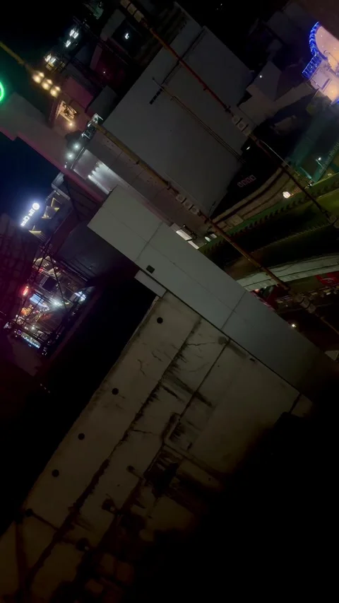 Portrait view of a busy city at night vi... | Stock Video | Pond5