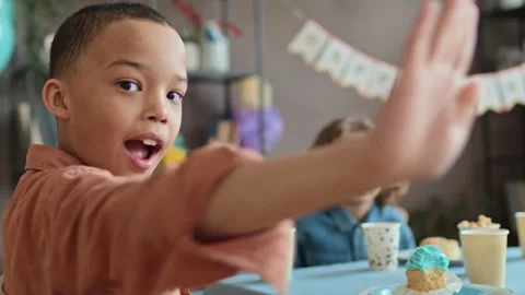 Portrait of Young Black Boy Eating Cake ... | Stock Video | Pond5