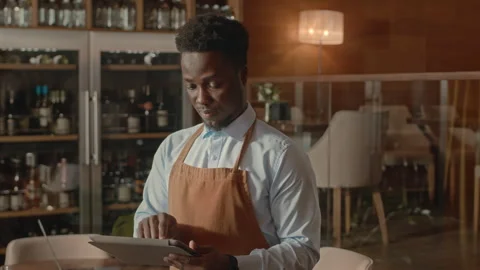 Portrait of Young Black Waiter with Digi... | Stock Video | Pond5
