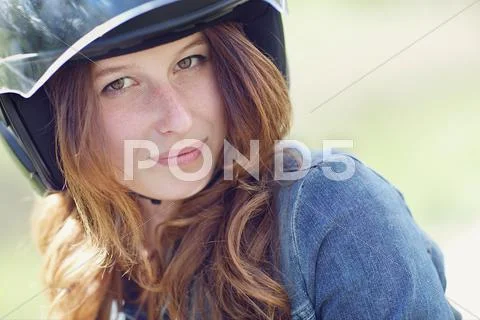 Portrait of a young girl in motorcycle helmet ~ Premium Photo #35141034