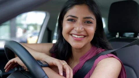 Portrait of young indian driver woman sm... | Stock Video | Pond5
