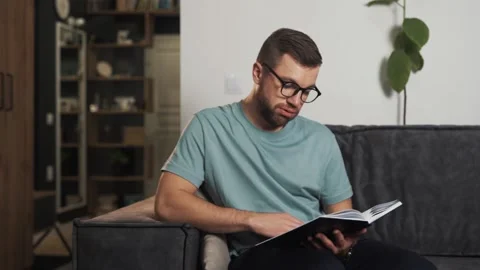 Portrait of a young man putting down a b... | Stock Video | Pond5