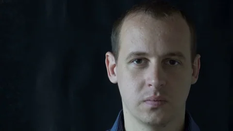 portrait of a young man staring at camer... | Stock Video | Pond5