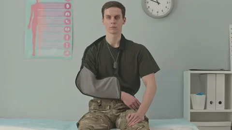 Portrait of Young Soldier with Broken Ar... | Stock Video | Pond5