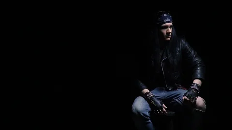 Posing rocker guy with long black hair, ... | Stock Video | Pond5