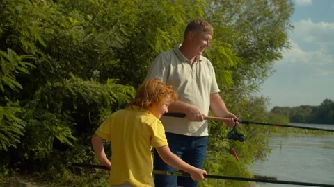 Positive little angler and father with f... | Stock Video | Pond5