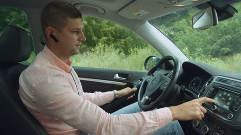 Positive male driver using trip computer... | Stock Video | Pond5