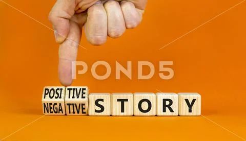 Photograph: Positive or negative story symbol. Businessman turns cubes ...
