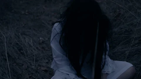 Possessed Girl with Long Black Hair Sits... | Stock Video | Pond5