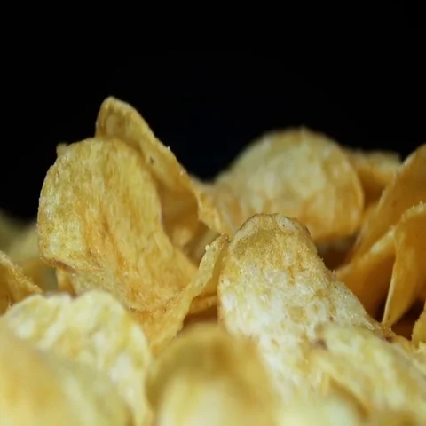 Potato Chips Rotating On Black Backgroun... | Stock Video | Pond5