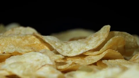 Potato Chips Rotating On Black Backgroun... | Stock Video | Pond5
