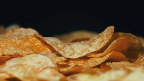 Potato Chips Rotating On Black Backgroun... | Stock Video | Pond5