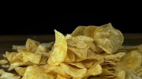 Potato Chips Rotating On Black Backgroun... | Stock Video | Pond5