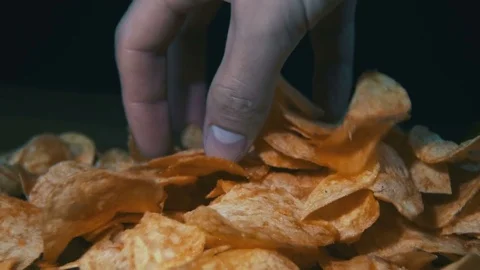 Potato Chips Rotating On Black Backgroun... | Stock Video | Pond5