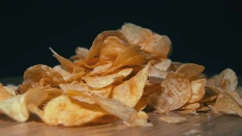 Potato Chips Rotating On Black Backgroun... | Stock Video | Pond5