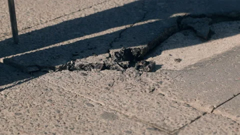 Pothole repair on a road. A close-up of ... | Stock Video | Pond5