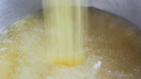 Pour corn flour into boiling water | Stock Video | Pond5
