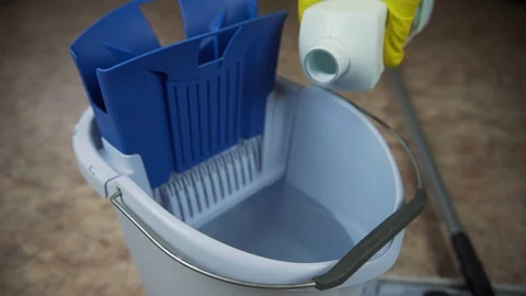 pour detergent into the bucket to clean ... | Stock Video | Pond5