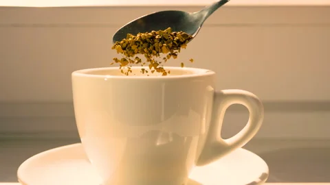 Pour instant coffee into a coffee cup sl... | Stock Video | Pond5