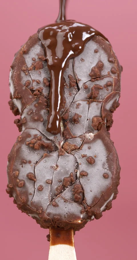 Pour the melted chocolate over the ice c... | Stock Video | Pond5