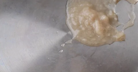 Pouring canned fish chowder into a pan f... | Stock Video | Pond5