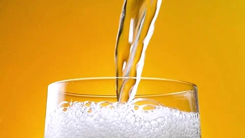 Pouring carbonated water into a glass. Y... | Stock Video | Pond5