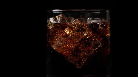Pouring coca cola into the glass | Stock Video | Pond5