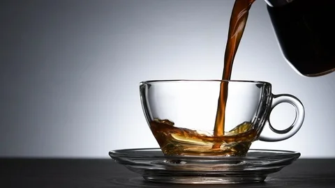 Pouring coffee on a transparent cup on b... | Stock Video | Pond5