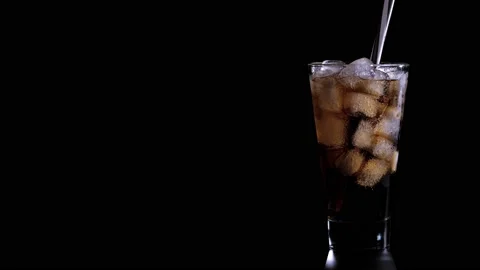 Pouring Cola with ice cubes. Cola drink ... | Stock Video | Pond5