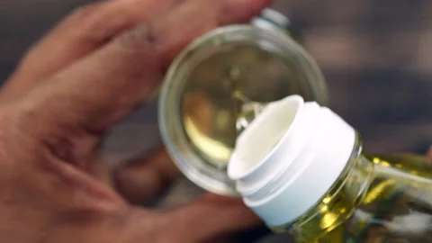 pouring cooking oil in a container top v... | Stock Video | Pond5